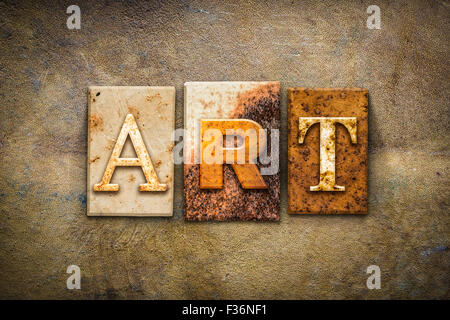 The word "ART" written in rusty metal letterpress type on a crumbled ...