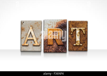 The word "ART" written in rusty metal letterpress type sitting on a ...