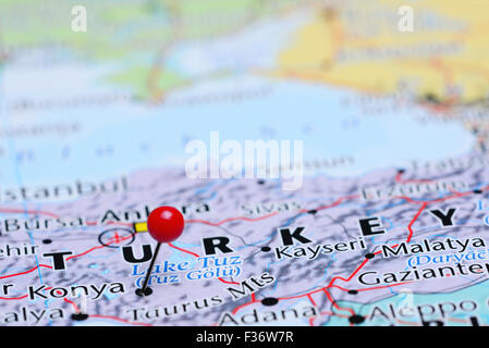 Close up to a Konya city with a red pin needle into Turkey country ...