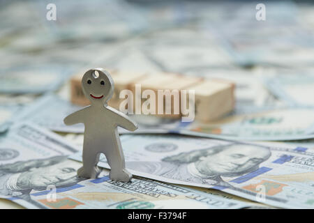 much money, money the inscription, a figure little man Stock Photo - Alamy