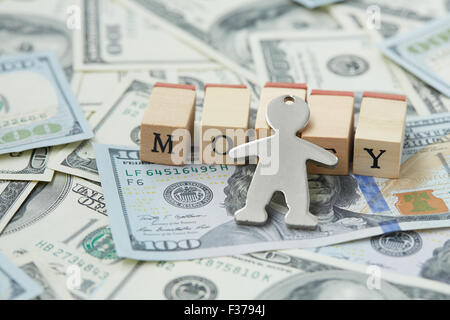 much money, money the inscription, a figure little man Stock Photo - Alamy