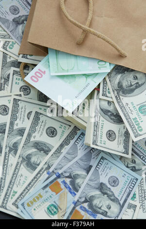 a lot of money out of a paper bag Stock Photo - Alamy