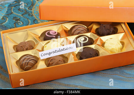 Congratulations card with box of assorted milky, white and pure ...