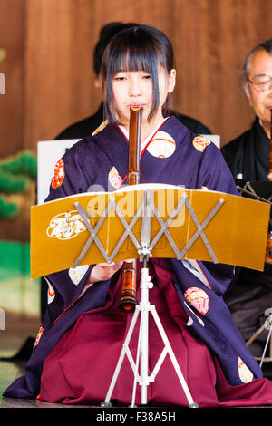 Kyoto, Yasaka shrine, Noh performance. Young Japanese woman kneeling ...