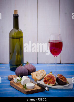 fresh goat cheese and grape fruit on wooden background Stock Photo - Alamy