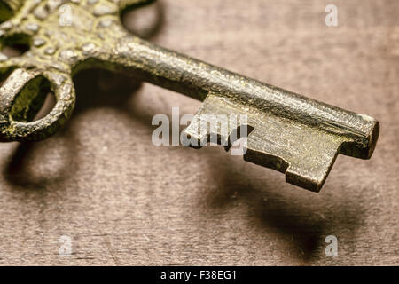 Old treasure key on wood surface Stock Photo - Alamy