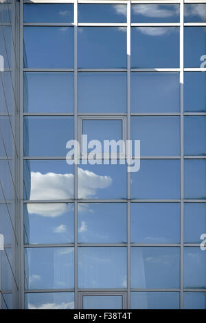 Reflection of the sky and clouds in the glazing of modern high-rise ...