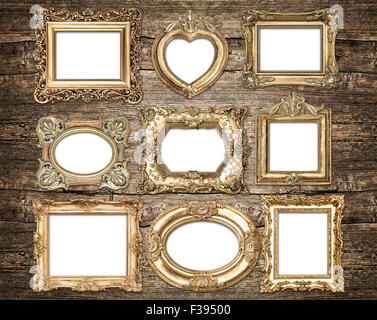 Baroque style golden picture frames over rustic wooden background ...