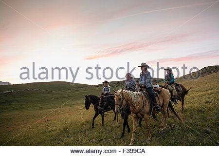 Woman Riding her Horse at Sunset Stock Photo - Alamy