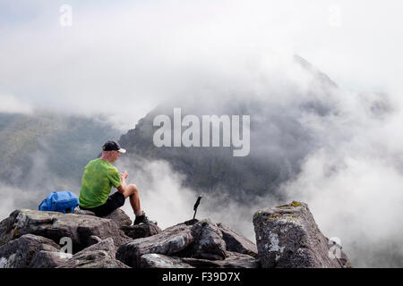 Hiker on Beenkeragh or Binn Chaorach ridge to Carrauntoohil in ...