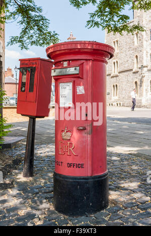 Windsor Berkshire traditional red pillar box alongside blue airmail ...