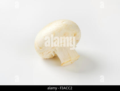 Single unpeeled white button mushroom Stock Photo - Alamy