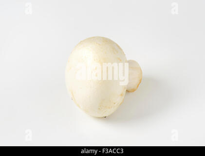 Single unpeeled white button mushroom Stock Photo - Alamy