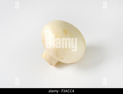 Single unpeeled white button mushroom Stock Photo - Alamy