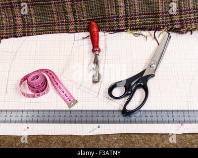 dressmaking still life - top view of cutting table with pattern ...