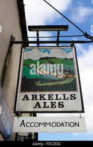 Traditional hanging pub sign at The Standing Order public house, a ...
