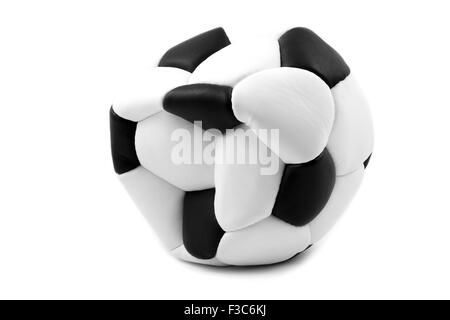 Deflated soccer ball isolated on white Stock Photo - Alamy