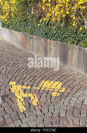 yellow parking symbol for loading and unloading area on the pavement ...