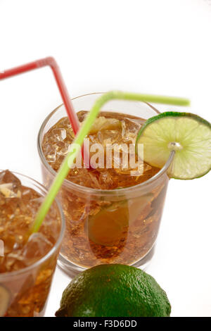 Fresh Fresh cocktail with cola drink and lime fruit on white background ...