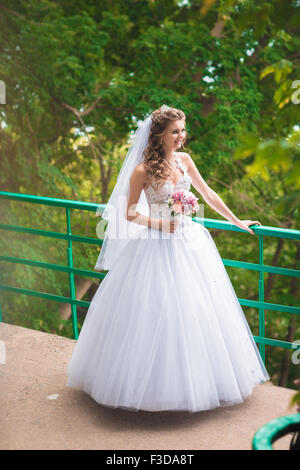 happy young bride on autumn forest background Stock Photo - Alamy