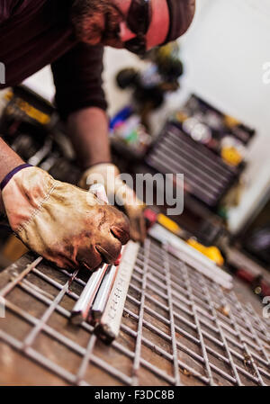 man using a metal ruler Stock Photo - Alamy