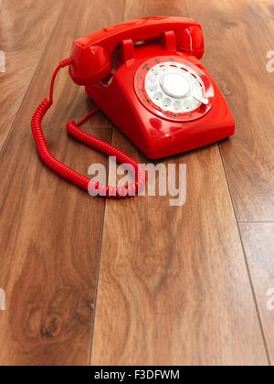 A close up photo of a red rotary phone Stock Photo - Alamy
