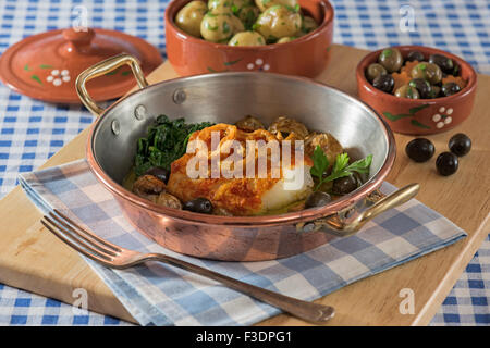 Typical portuguese dish Bacalhau a Lagareiro (cod fish with olive oil ...