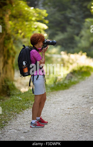 Professional nature photographer taking photos by the river side Stock ...