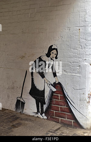 Banksy street art cleaning the streets England UK Stock Photo - Alamy