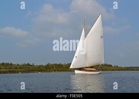 Traditional gaff-rigged Broads sailing yacht on Barton Broad, Norfolk ...