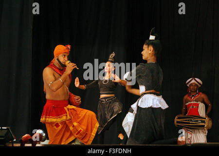 Cobra dance ; depicts the movements of the cobra and the taming of it ...