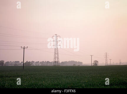 Electricity pylons at dusk Gloucestershire England UK Europe Stock ...