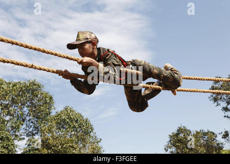 Commando Obstacles training ; cadet crossing the distance with Hand and ...