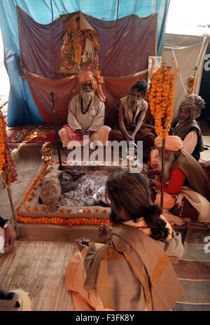 naga Sadhus or holy men of Juna Akhara come out after taking a holy dip ...