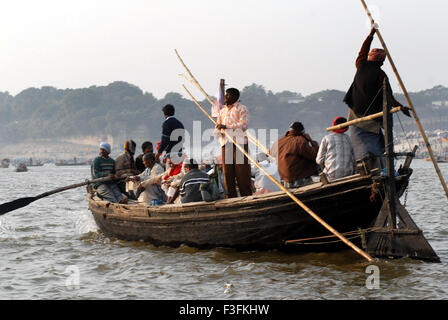Boats ferry devotees at the confluence of the Ganges ; Yamuna the ...