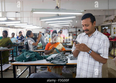 India, Tamil Nadu, Tirupur , women work in fair trade textile factory, production of garments ...