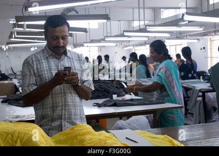 India, Tamil Nadu, Tirupur , women work in fair trade textile factory, production of garments ...