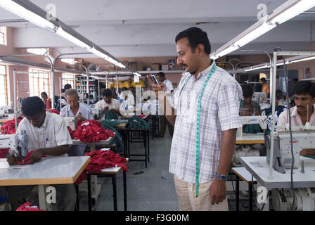 INDIA, Tamil Nadu, Tirupur, textile factory, worker sew garments for ...