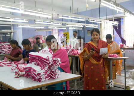 India, Tamil Nadu, Tirupur , women work in fair trade textile factory, production of garments ...