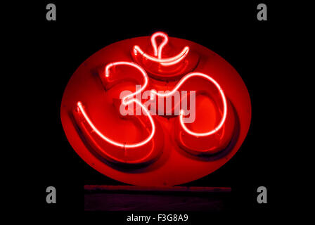 OM cosmic creation holy symbol of Hindu illuminated neon sign in red ...