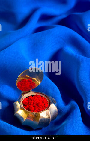 Red sindoor or kumkum or vermillion powder in wooden box on white Stock ...