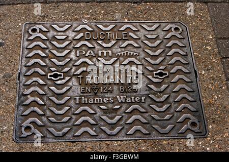 Thames water manhole cover Stock Photo - Alamy