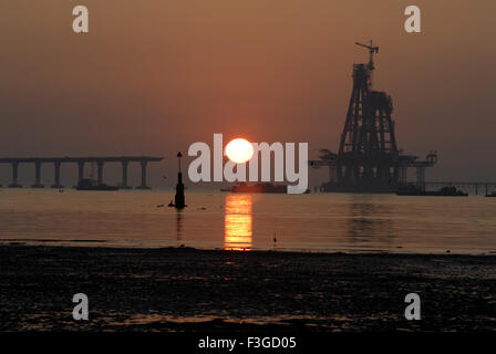 Sunset at Mahim Beach near Worli sea link bridge under construction ...
