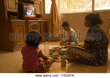 Indian middle class urban family of four father mother son daughter ...