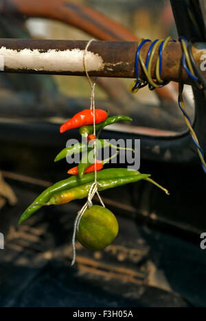Nimbu mirchi aka lemon and chilli tied on bar common superstition to ...