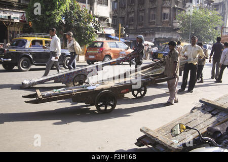 Man pulling hand cart ; Sardar Vallabhbhai Patel road ; Grant road ...
