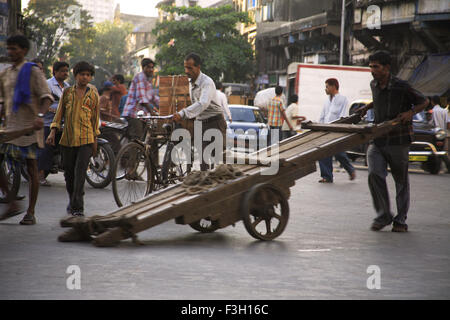 Man pulling hand cart ; Sardar Vallabhbhai Patel road ; Grant road ...