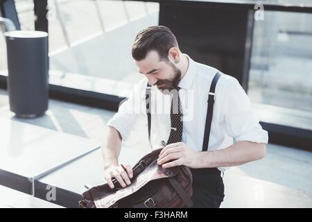 Businessman with stylish briefcase on city street Stock Photo - Alamy