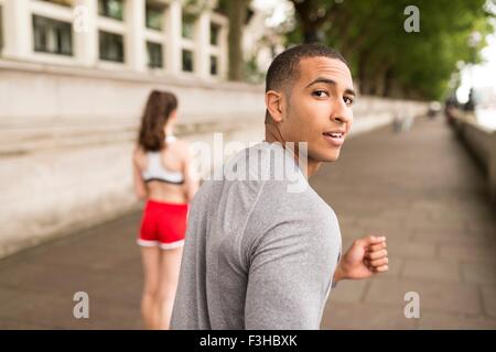 Man Running Looking Over His Shoulder, motion blur Stock Photo - Alamy