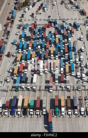 trucks lined up at container facility aerial view Stock Photo - Alamy